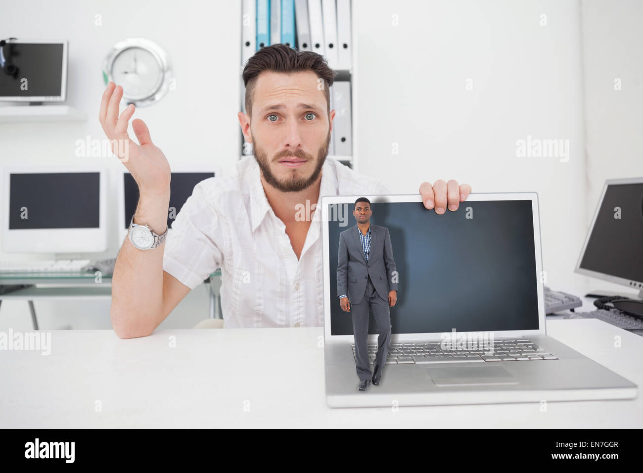 Composite image of businessman standing looking at camera Stock Photo ...