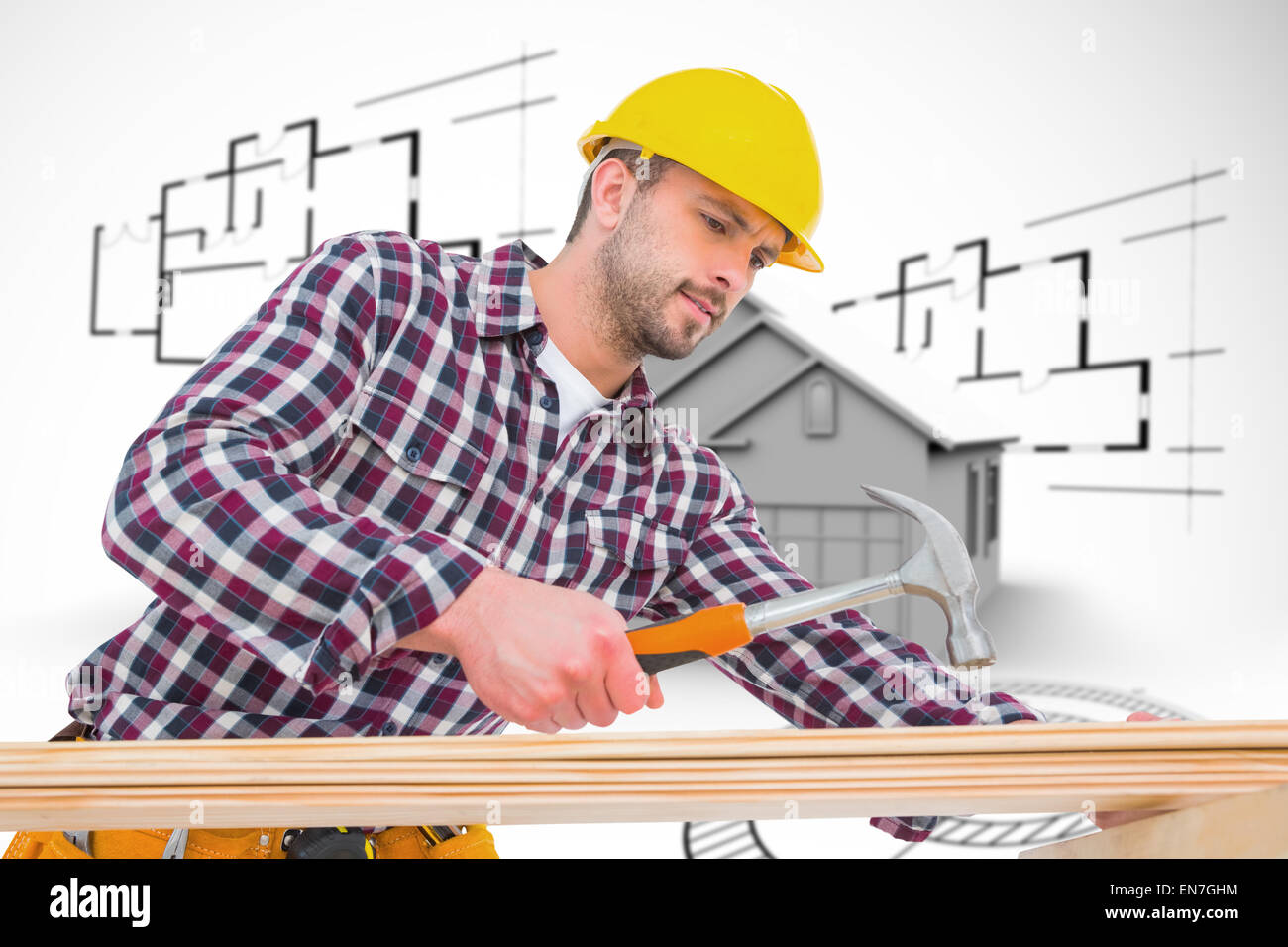 Composite image of handyman using hammer on wood Stock Photo - Alamy