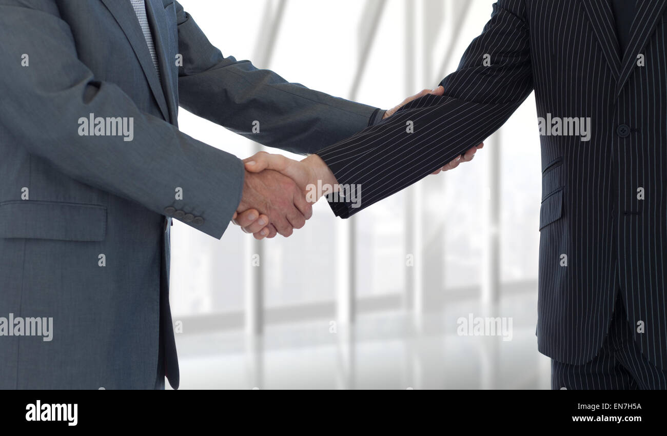 Handshake city in background hi-res stock photography and images - Alamy