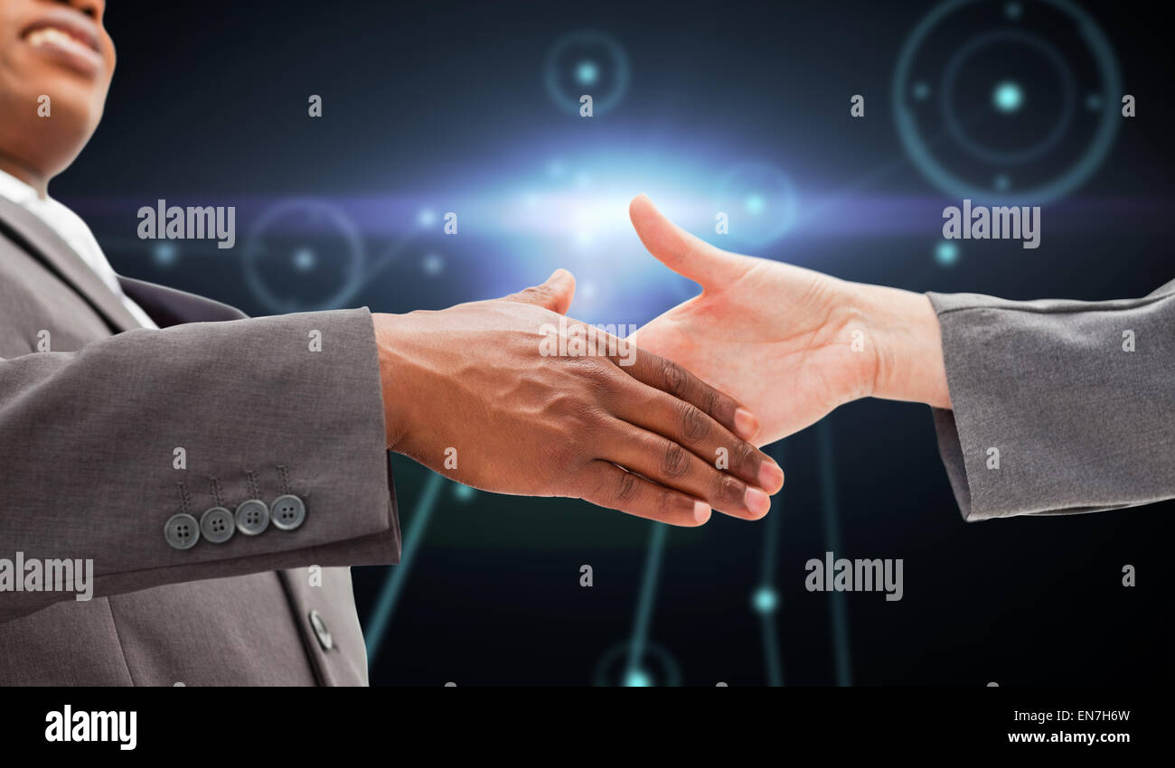 Composite image of businessman going shaking a hand Stock Photo - Alamy
