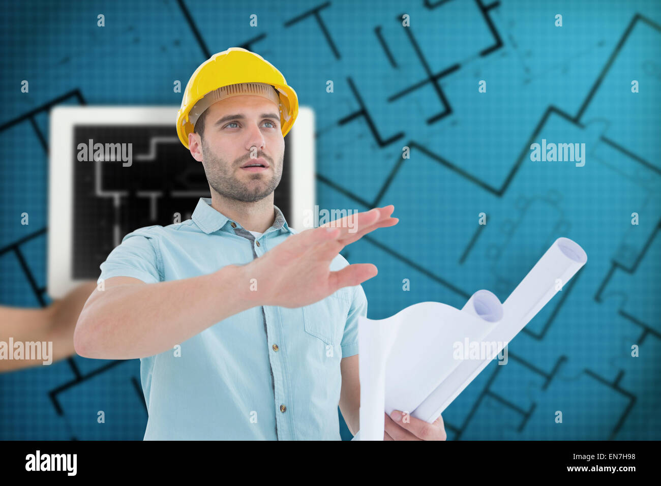 Composite image of architect with blueprint gesturing on white ...