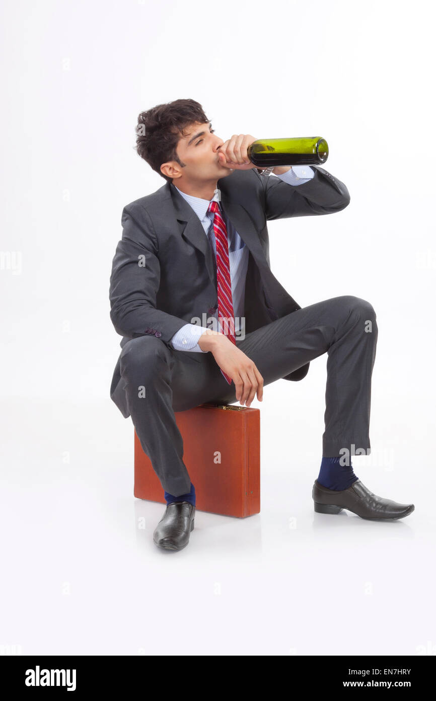 Businessman drinking alcohol Stock Photo - Alamy