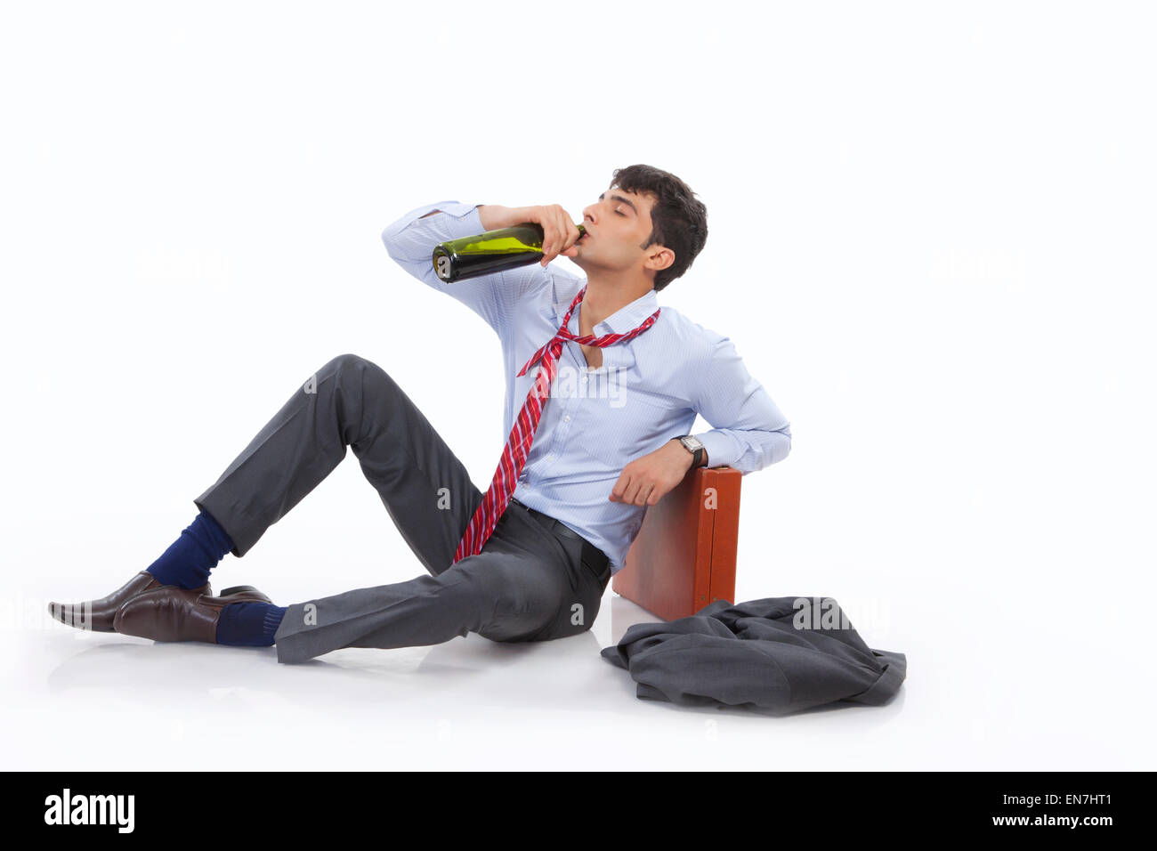 Business executive getting drunk Stock Photo - Alamy