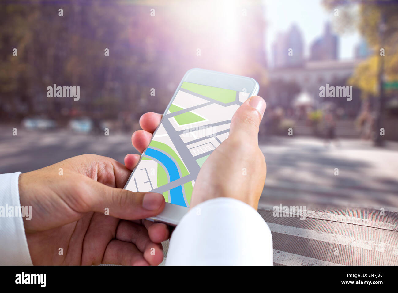 Composite image of man using map app on phone Stock Photo - Alamy