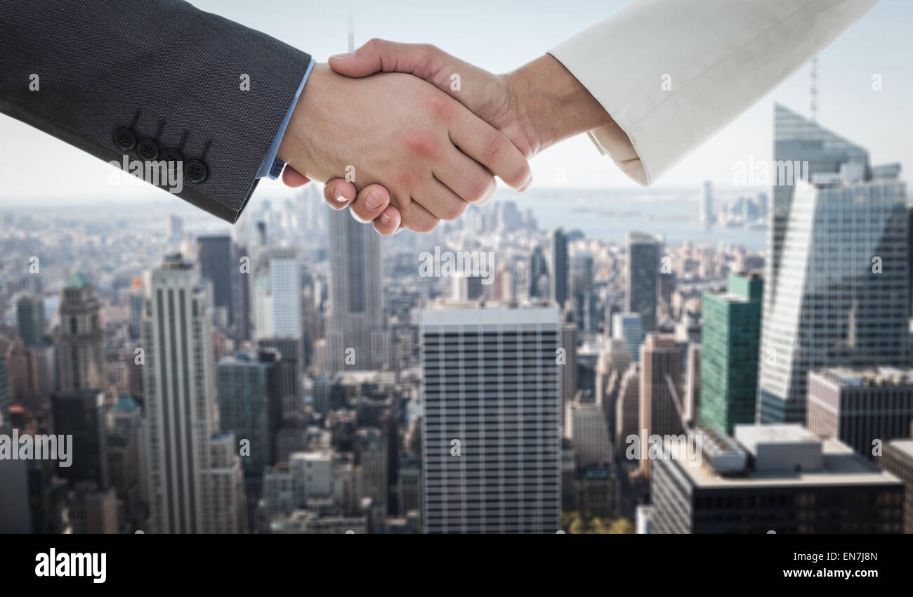 Composite image of shaking hands Stock Photo - Alamy