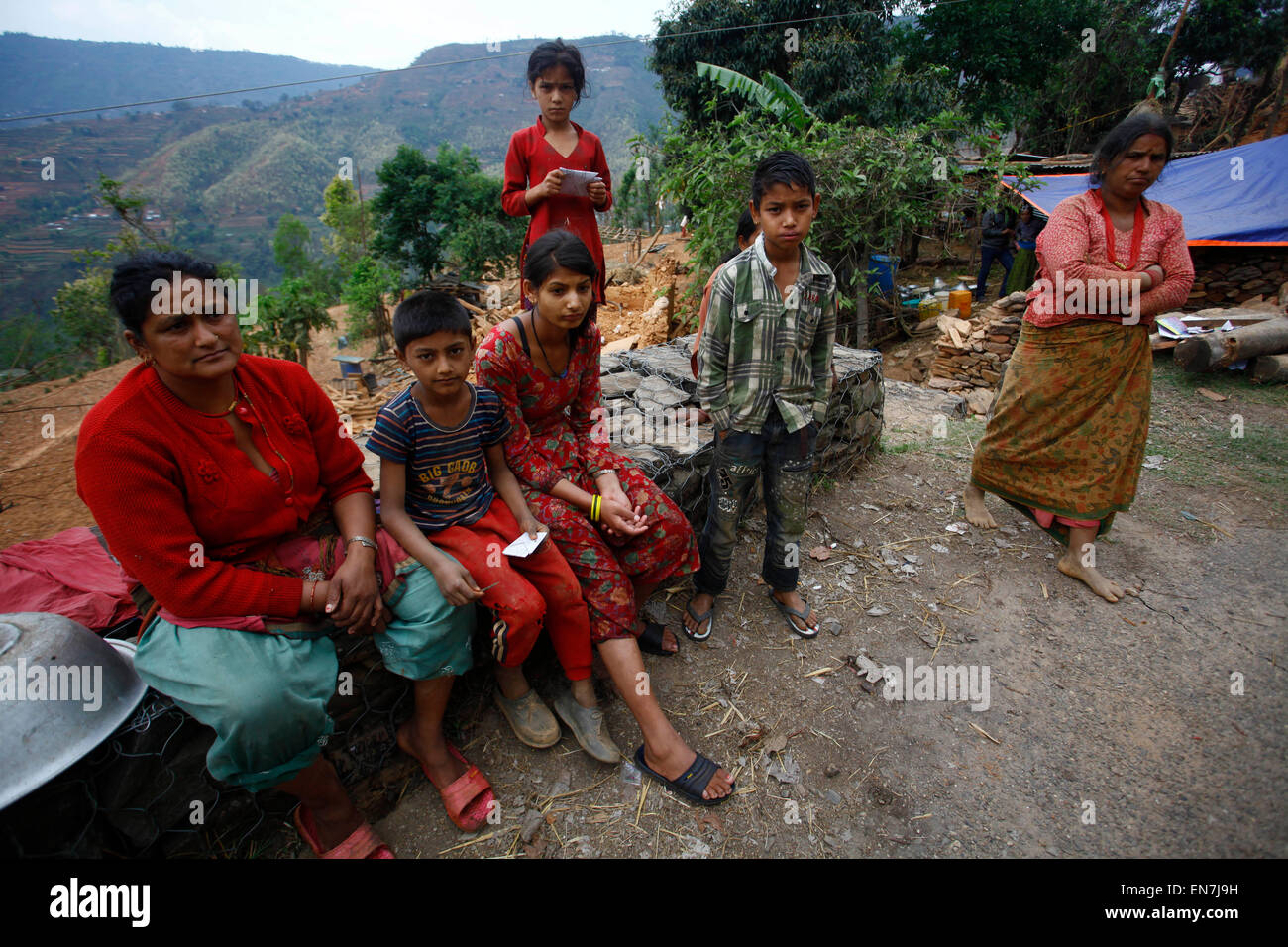 Sindhupalchowk, Nepal. 29th Apr, 2015. People gather near destructed ...