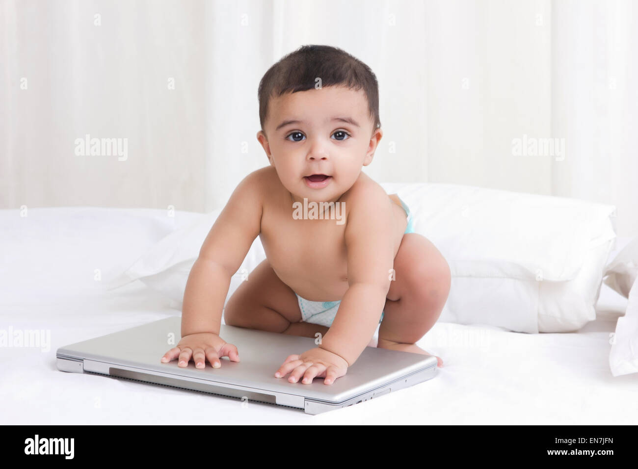 Portrait of baby with laptop Stock Photo - Alamy