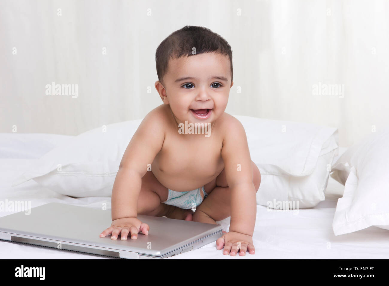 Baby with laptop Stock Photo - Alamy