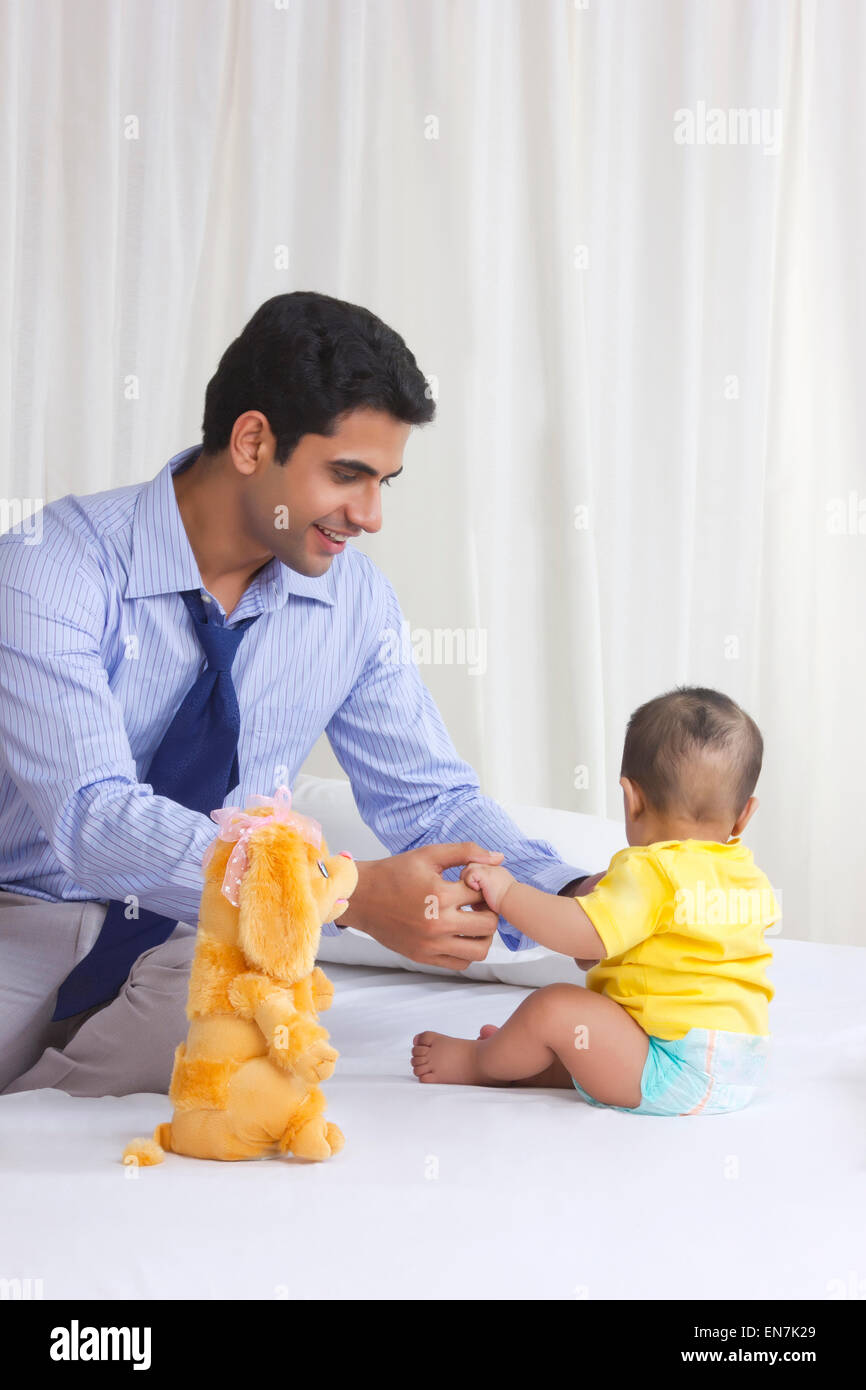 Father playing with baby Stock Photo - Alamy