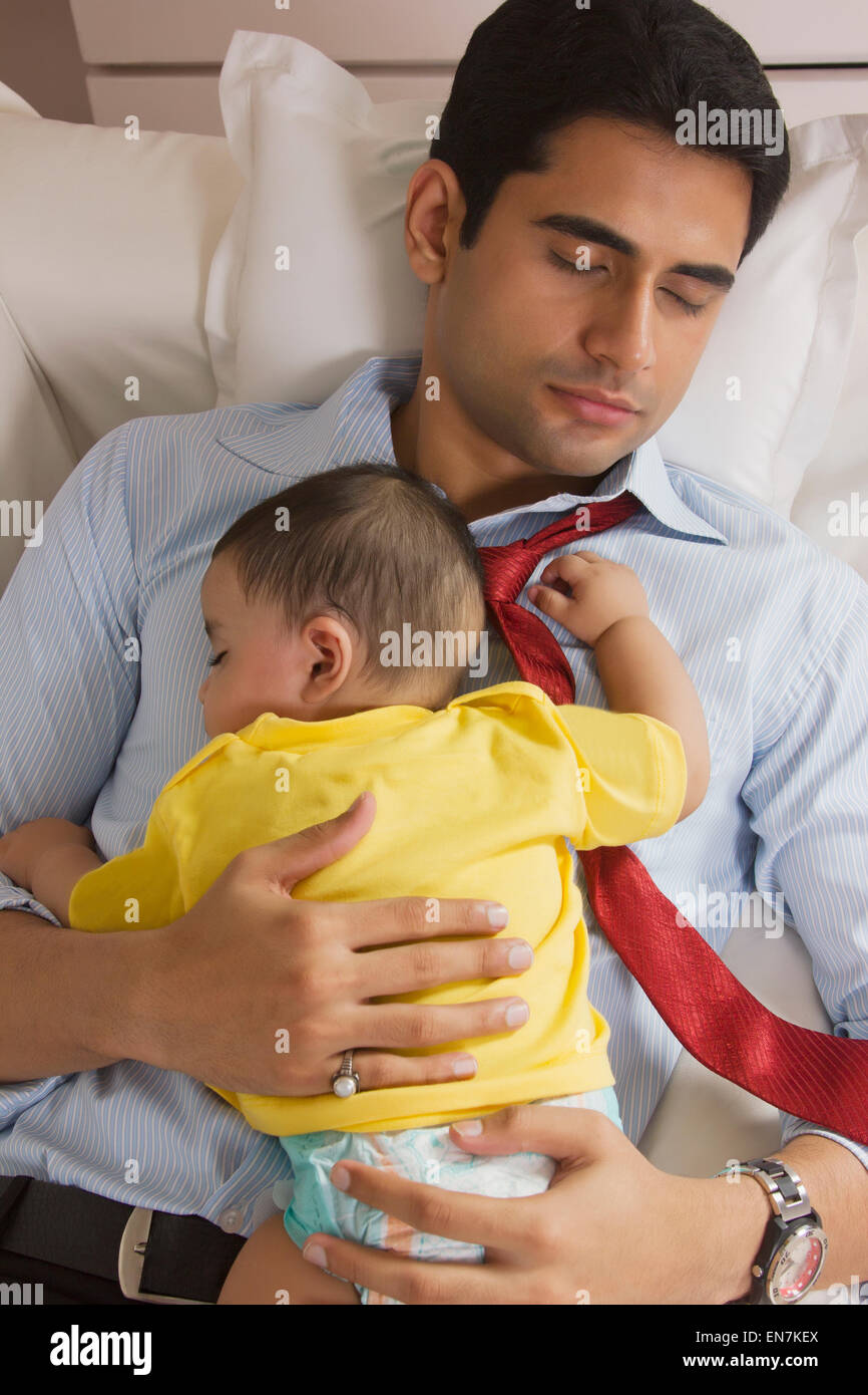 Father and baby sleeping Stock Photo - Alamy