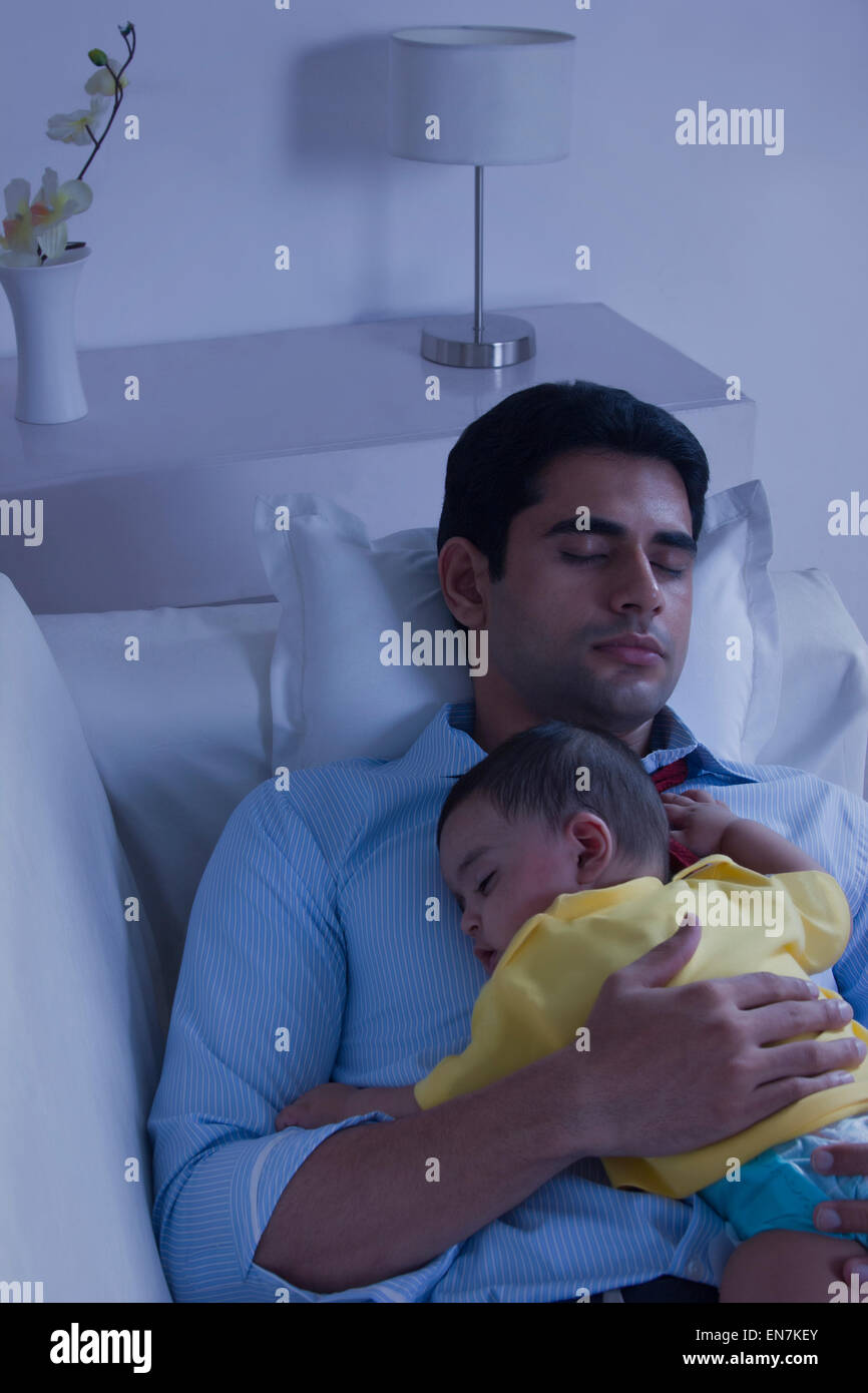 Father and baby sleeping Stock Photo - Alamy