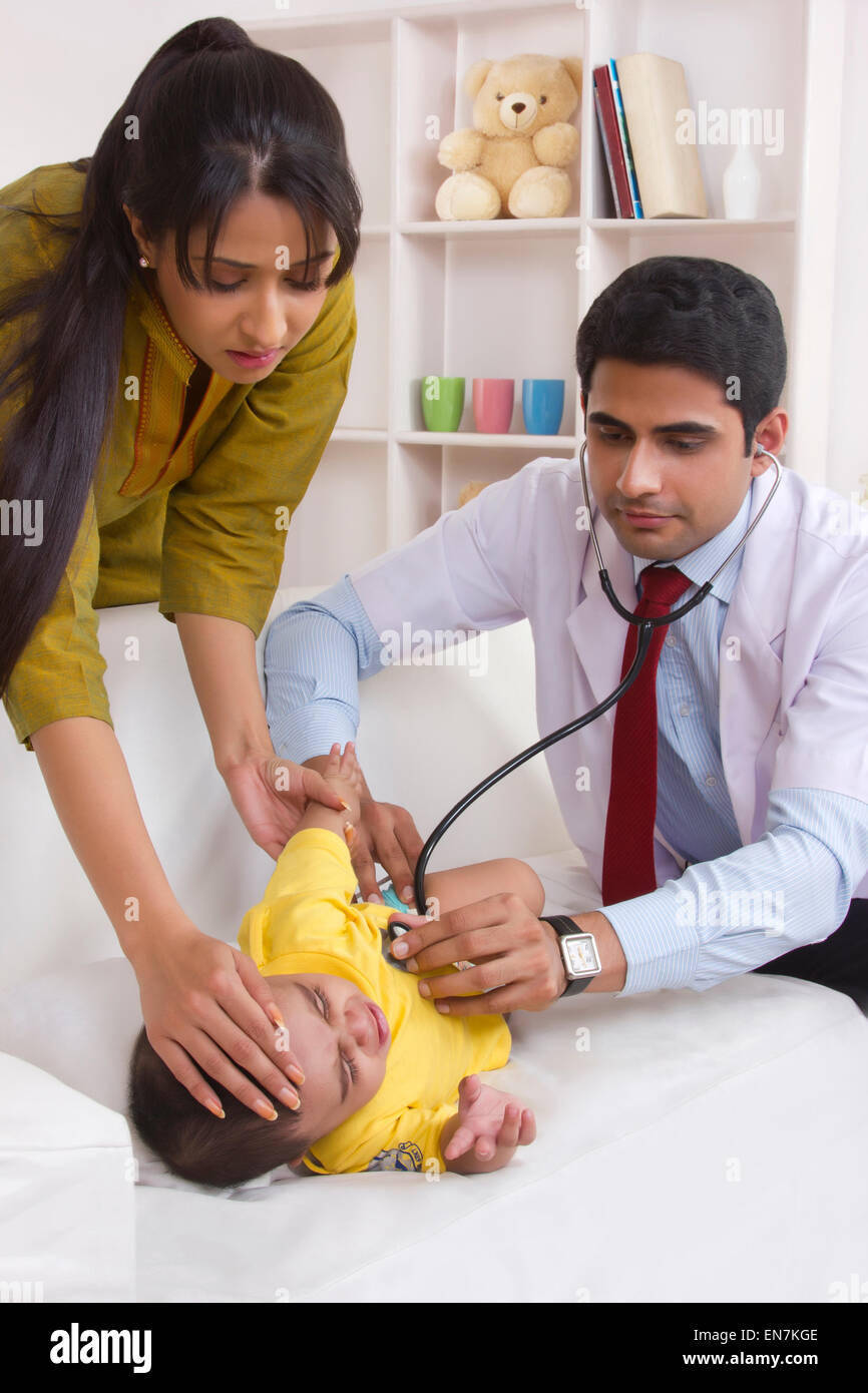 Baby boy having medical examination Stock Photo - Alamy