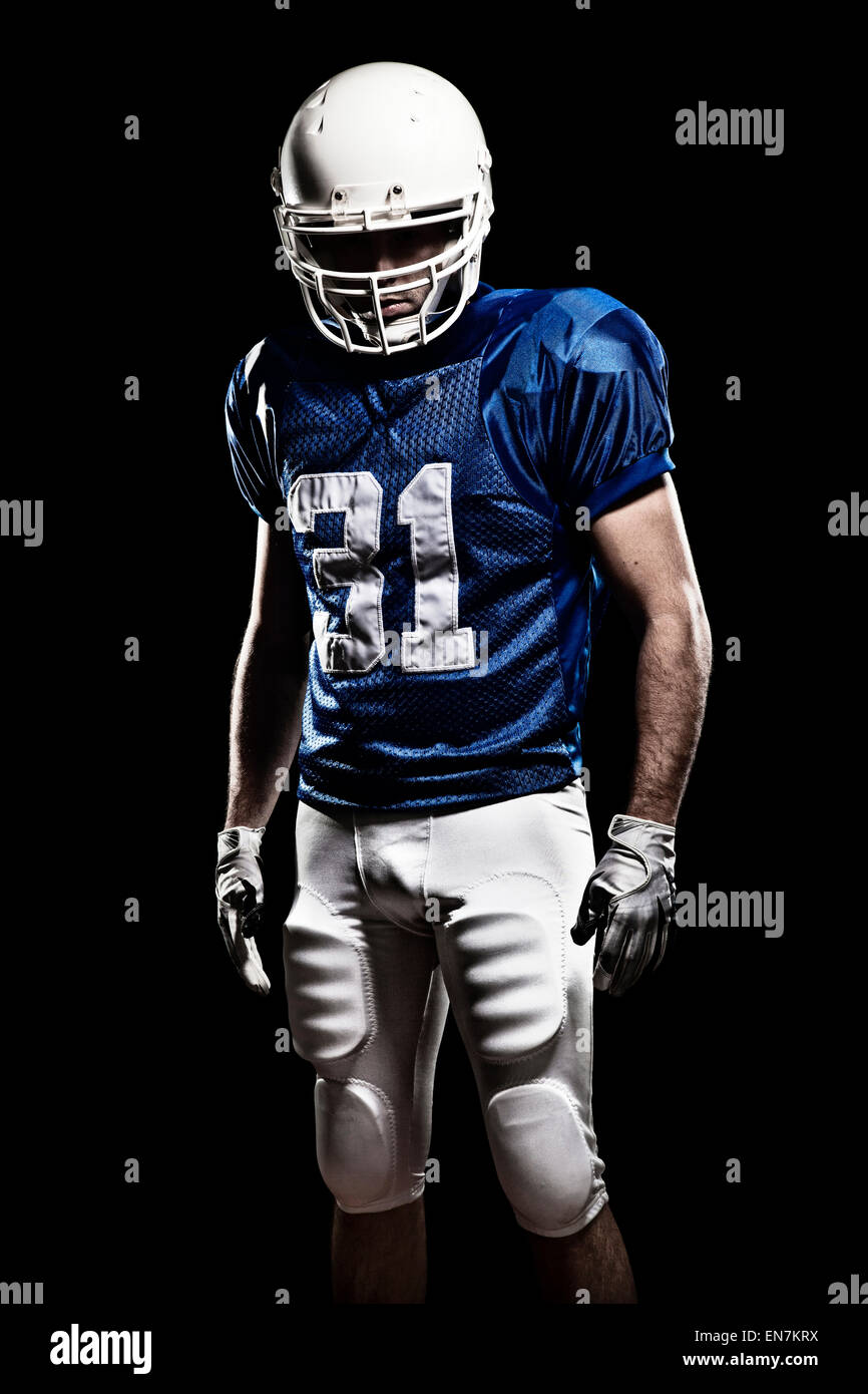 Football Player with number on a blue uniform. Studio shot Stock Photo ...