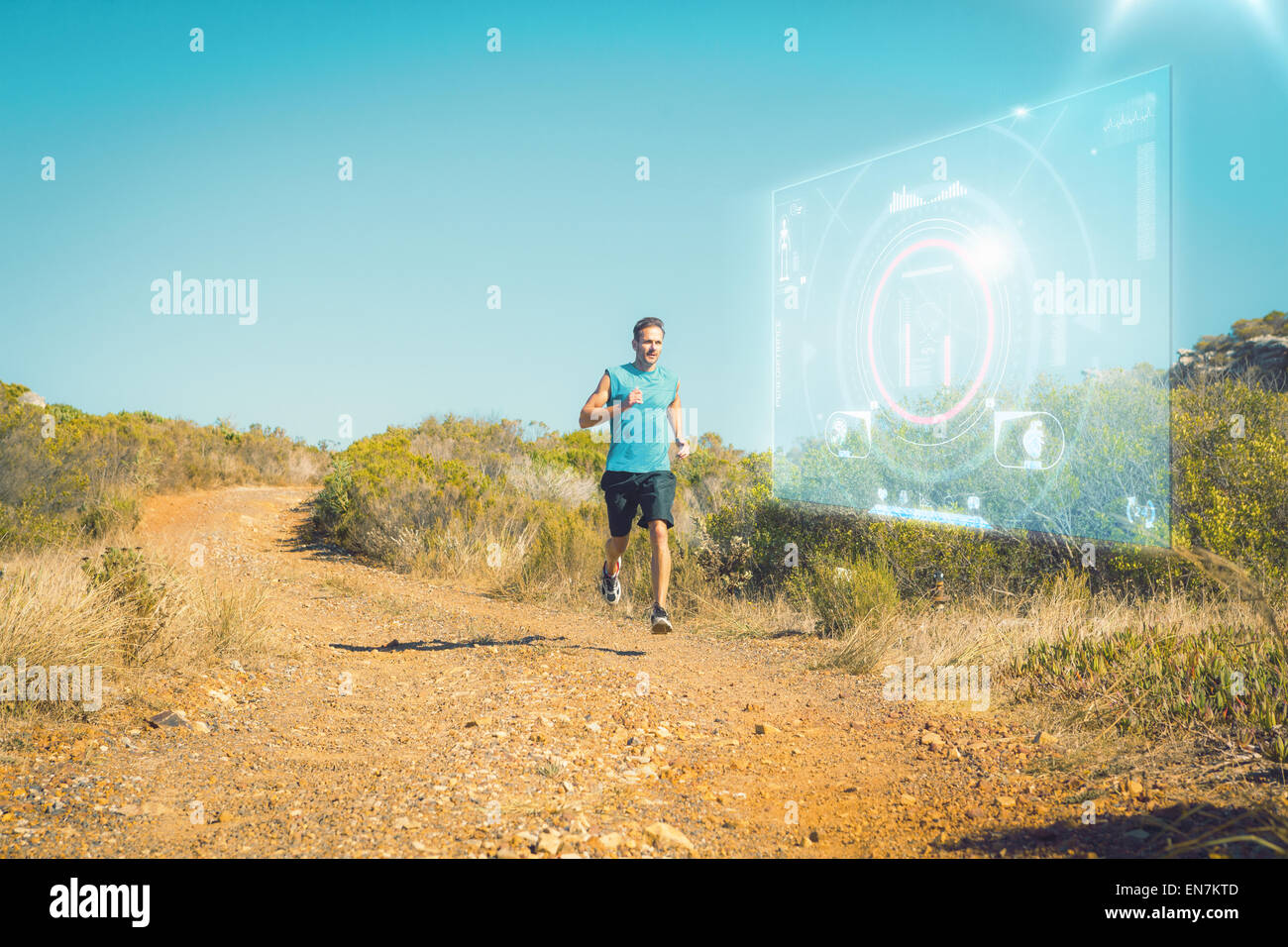 Composite image of athletic man jogging on country trail Stock Photo - Alamy