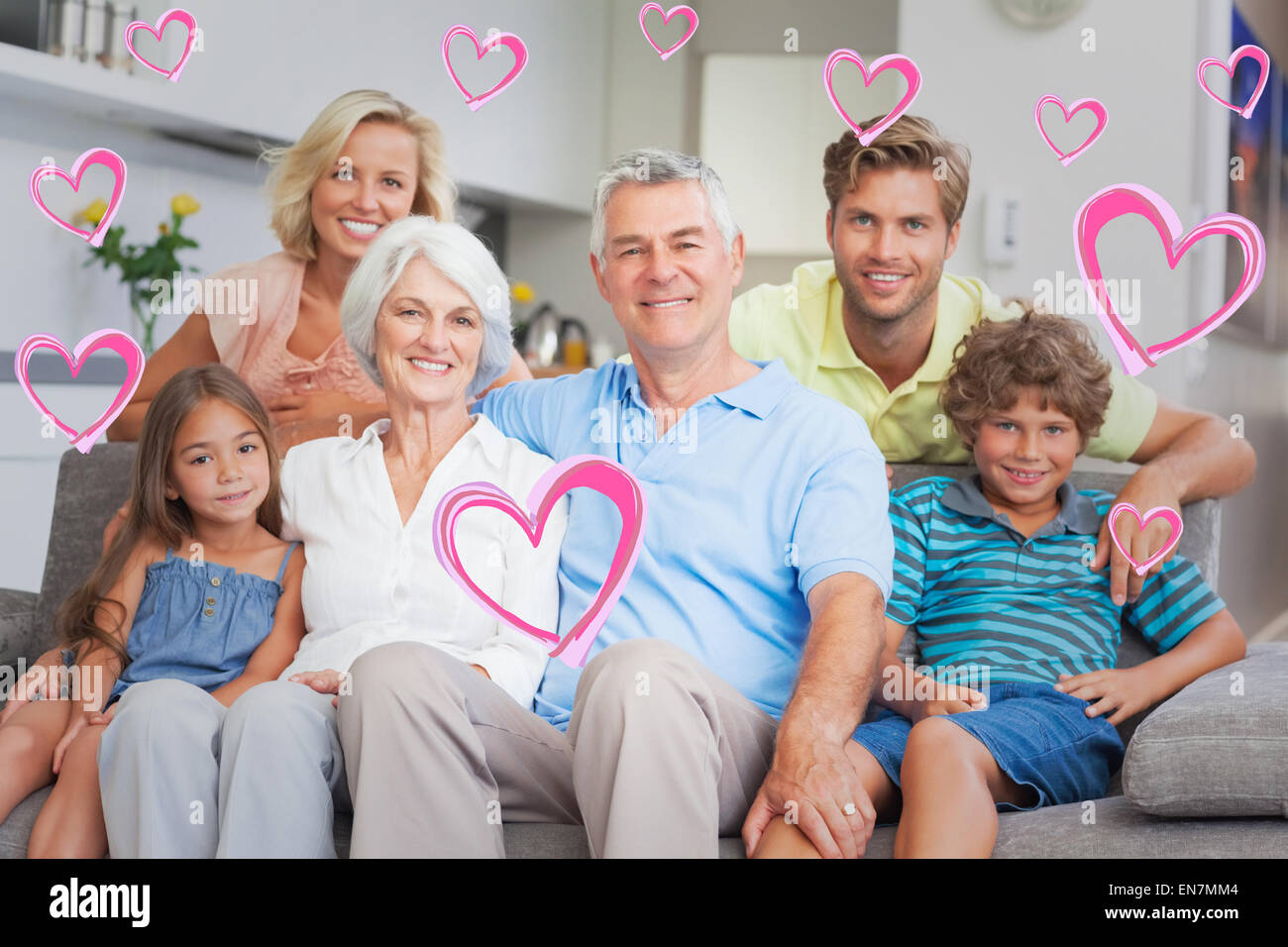 Composite image of multigeneration family posing in the living room ...