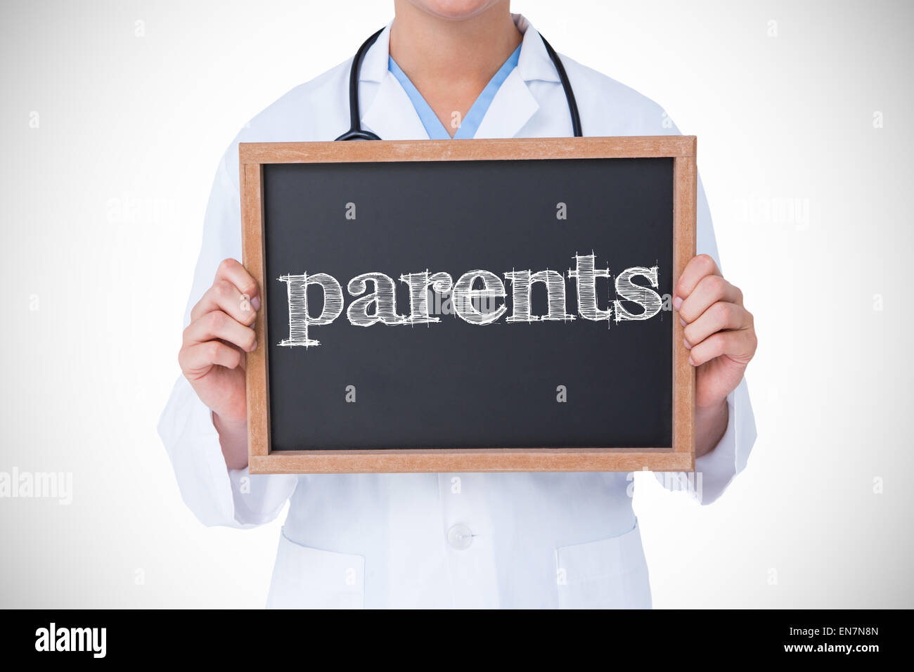 Parents against doctor showing little blackboard Stock Photo - Alamy