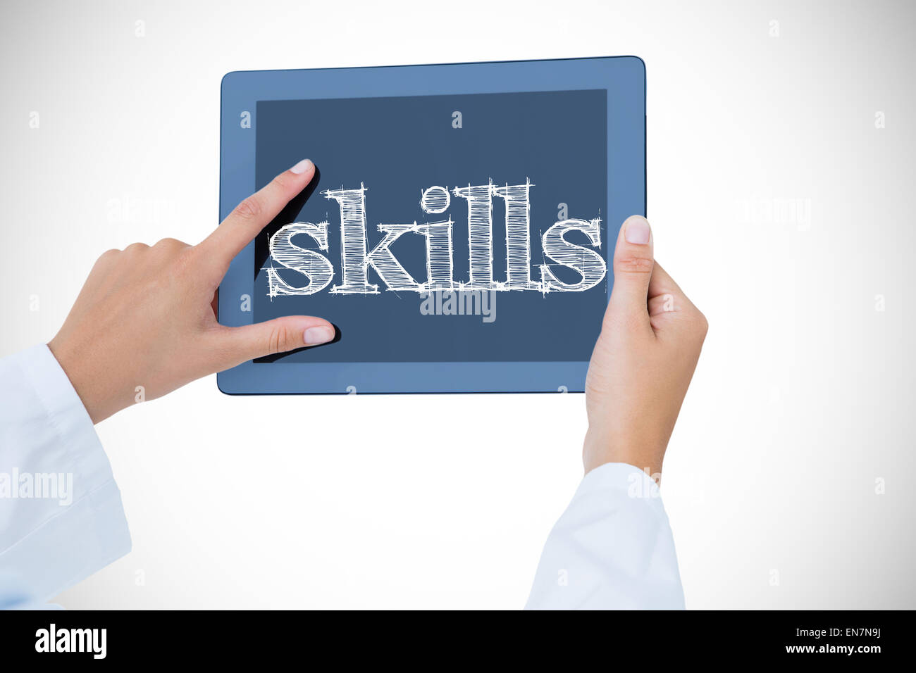 Skills against doctor using tablet pc Stock Photo - Alamy