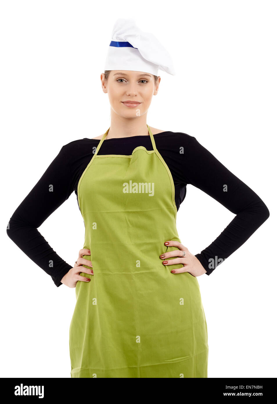Studio shot of a happy young woman cook standing akimbo, isolated on ...