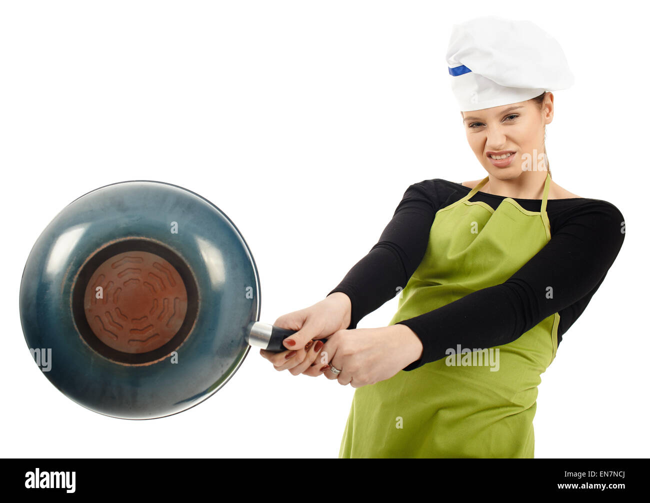 Angry woman cook hitting hard with the frying pan Stock Photo - Alamy