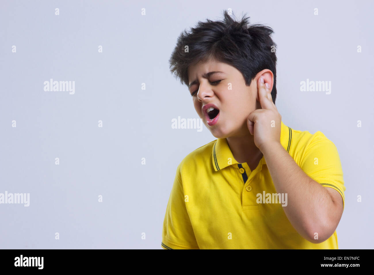 Boy with pain in ear Stock Photo - Alamy