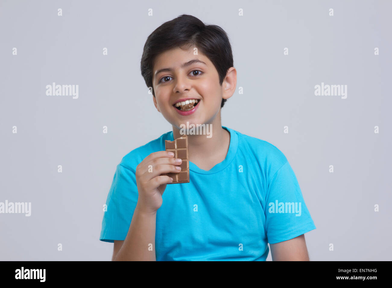 Portrait of boy eating chocolate Stock Photo - Alamy