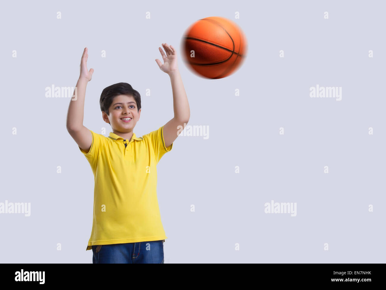 Indian boy playing basketball hi-res stock photography and images - Alamy