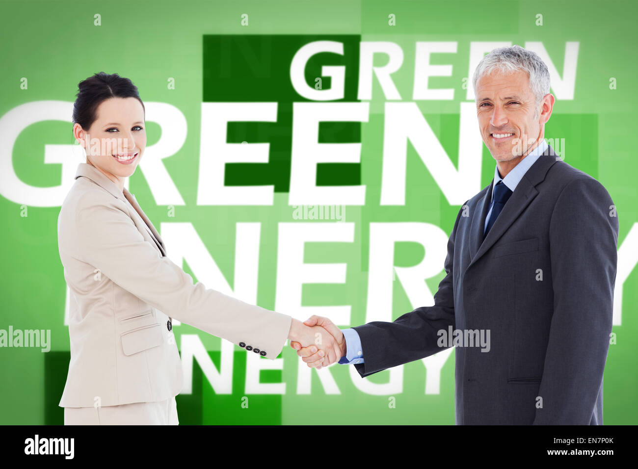 Composite image of smiling business people shaking hands while looking ...