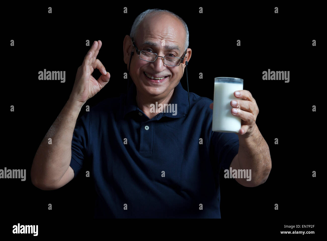 Portrait of old man with glass of milk Stock Photo - Alamy