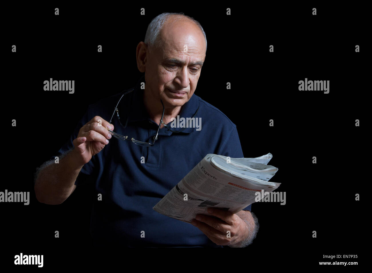 Old man reading newspaper Stock Photo - Alamy