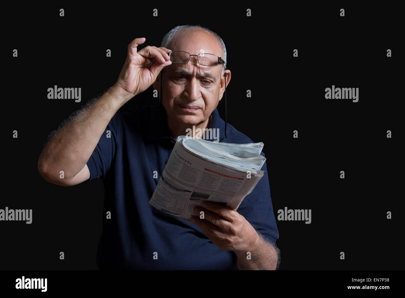 Old man reading newspaper Stock Photo - Alamy
