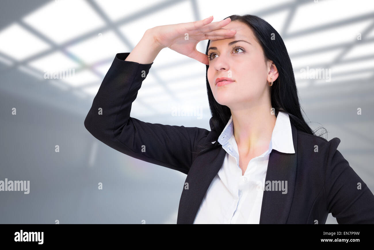 Composite image of pretty businesswoman looking with hand up Stock ...