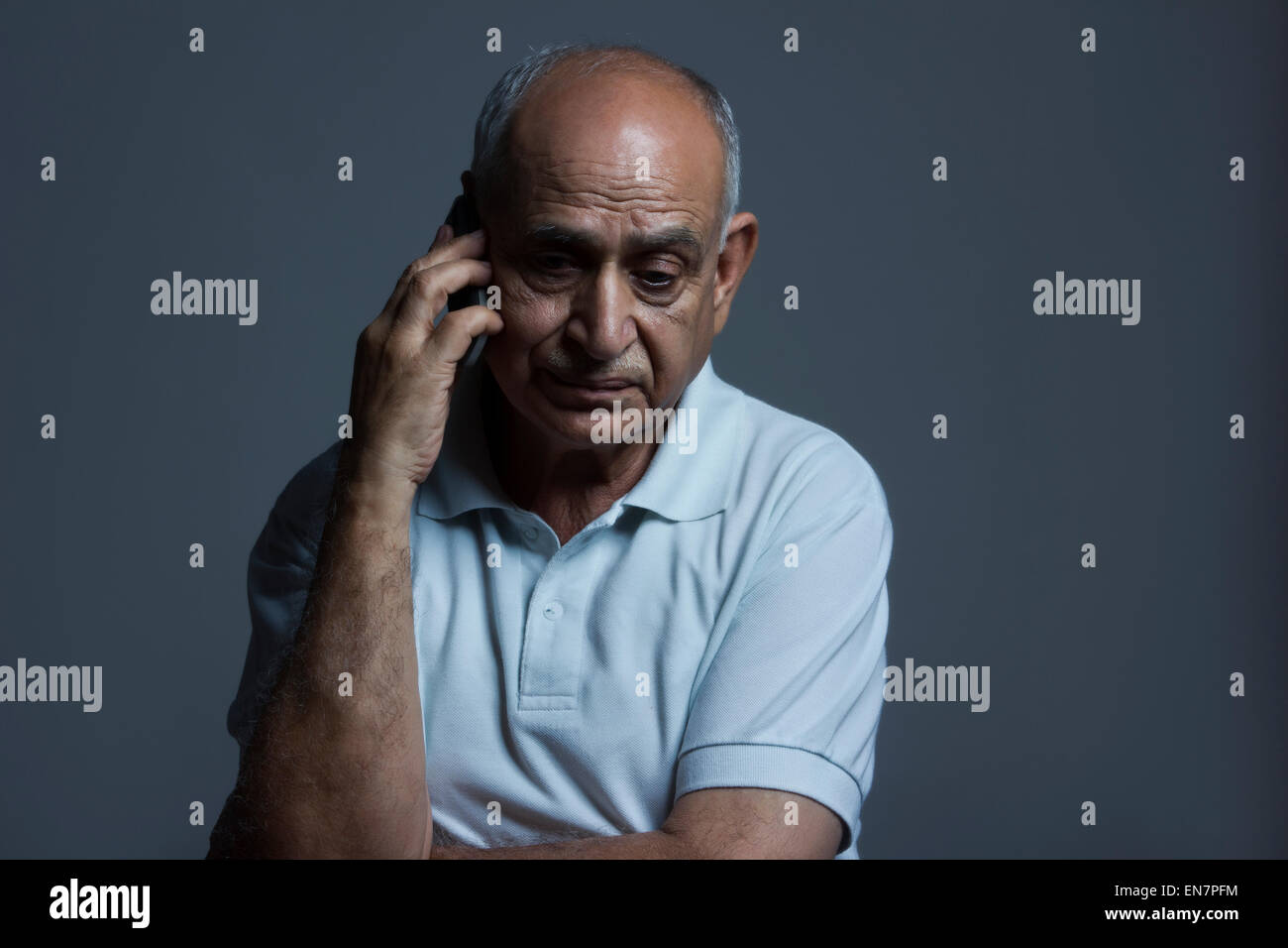 Old man talking on mobile phone Stock Photo - Alamy