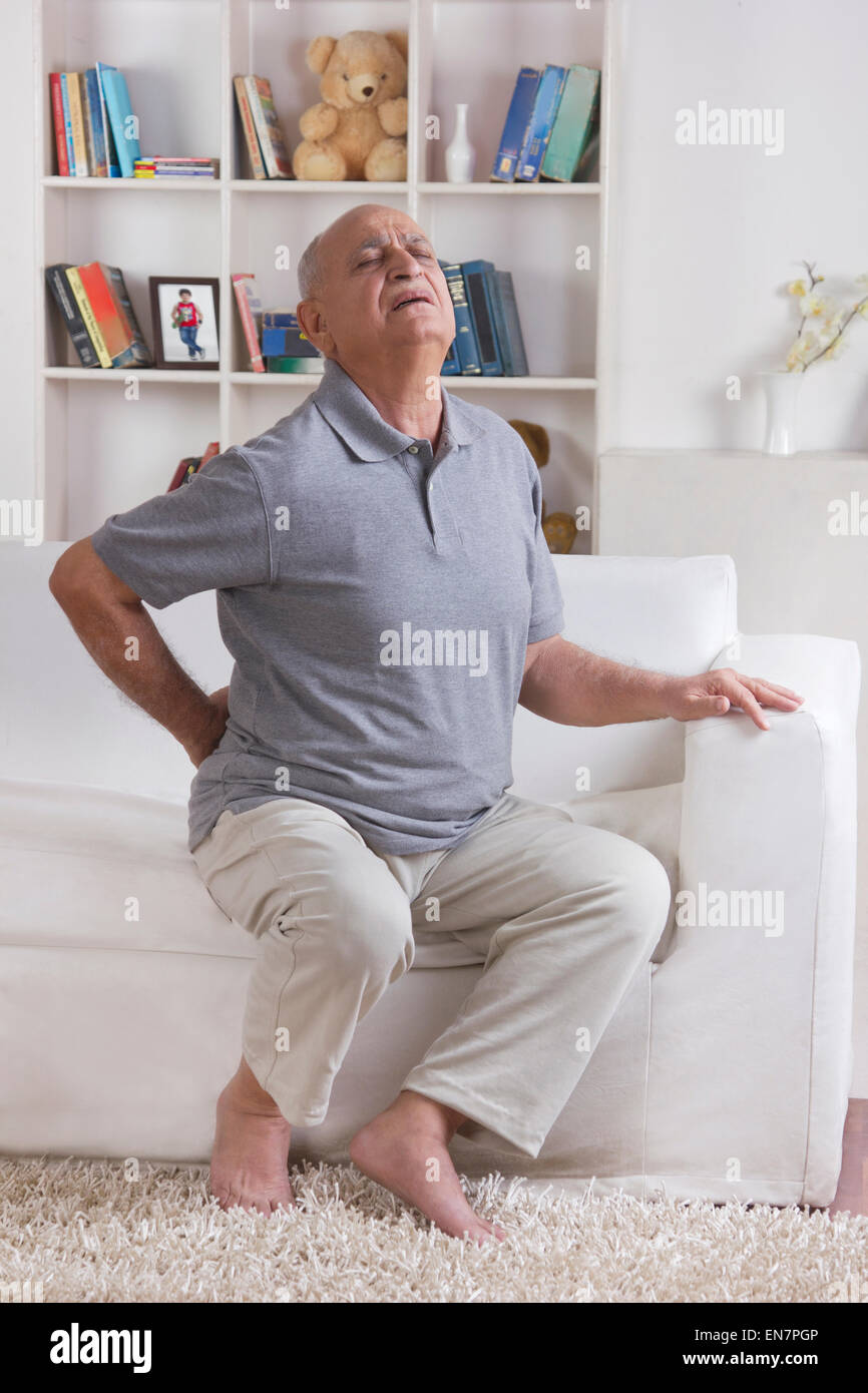 Old man with backache Stock Photo - Alamy