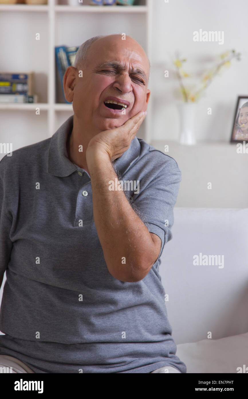 Old man with toothache Stock Photo - Alamy