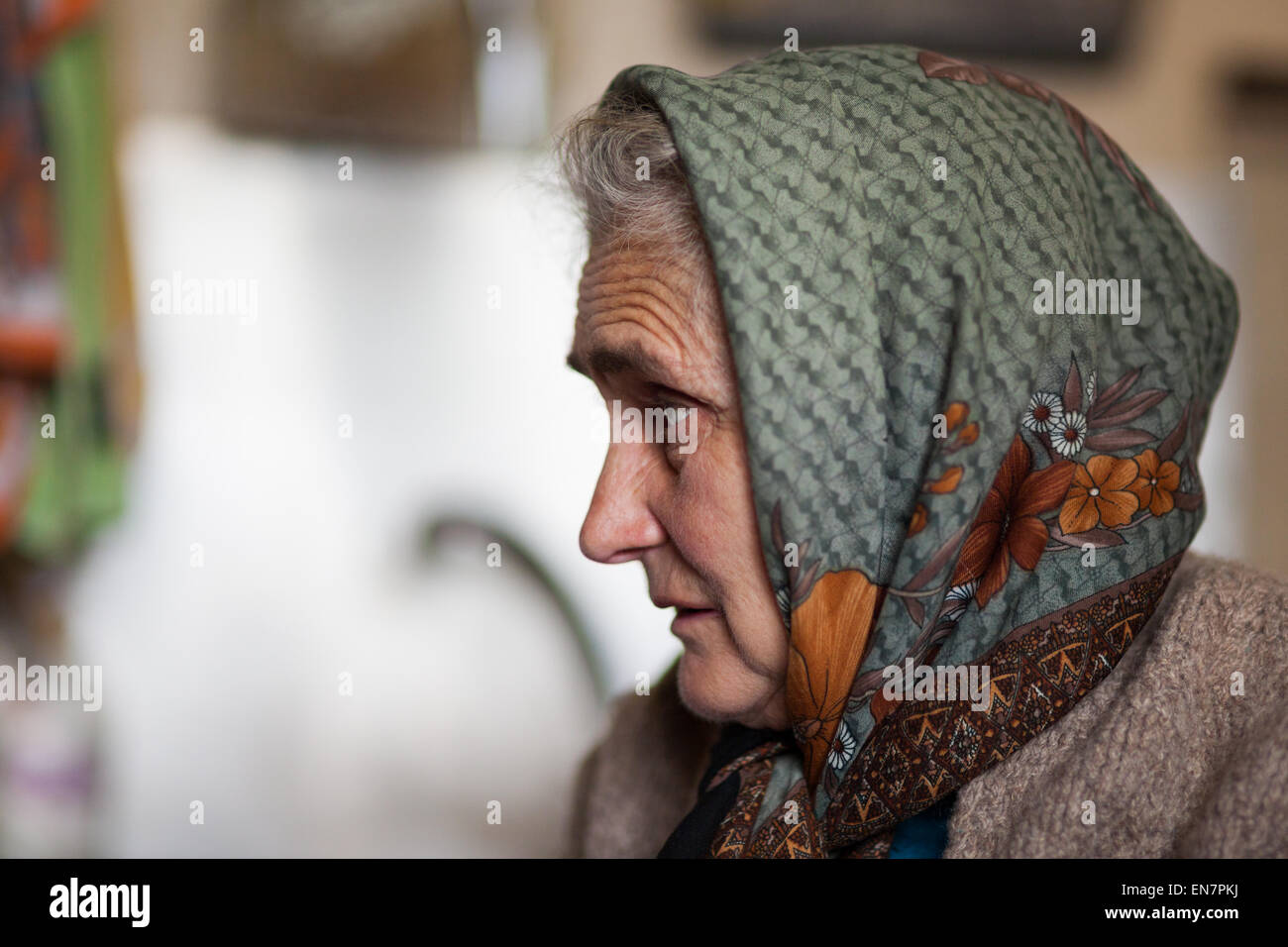 Profile portrait of a rural woman indoor Stock Photo - Alamy