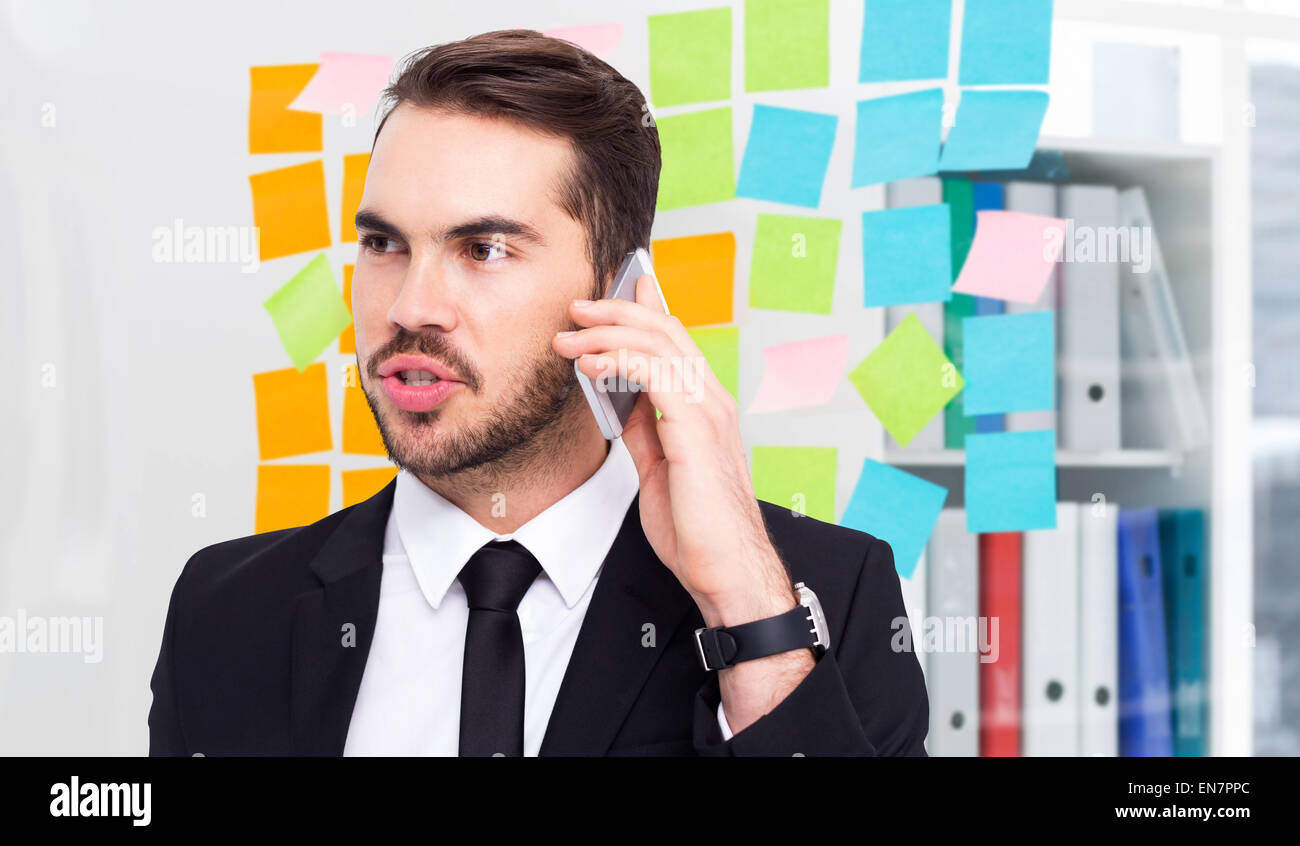 Composite image of smart businessman speaking on the phone Stock Photo ...