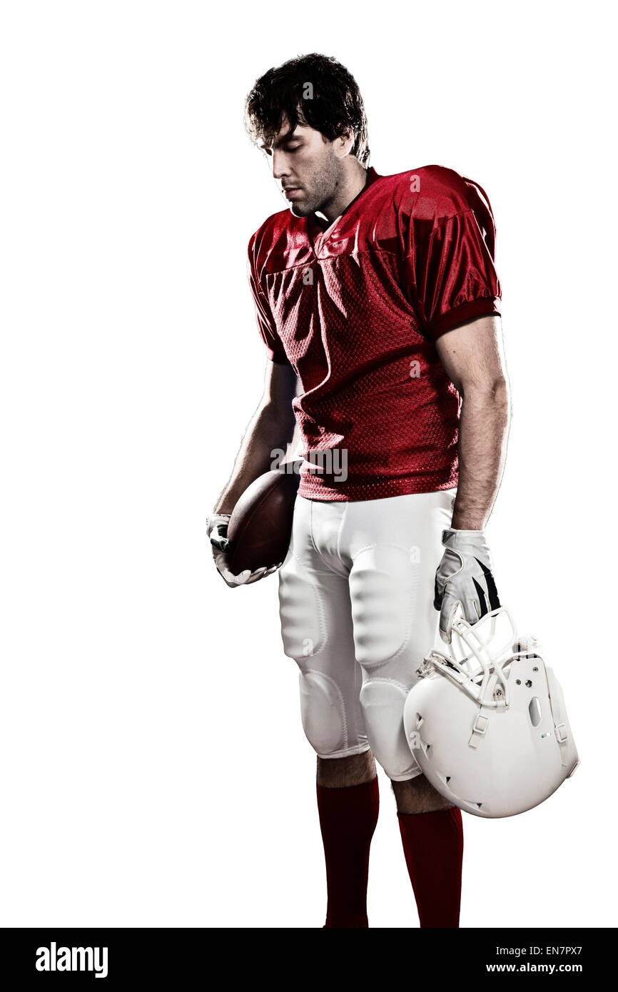 Football Player with a red uniform and a ball in the hand on a white ...