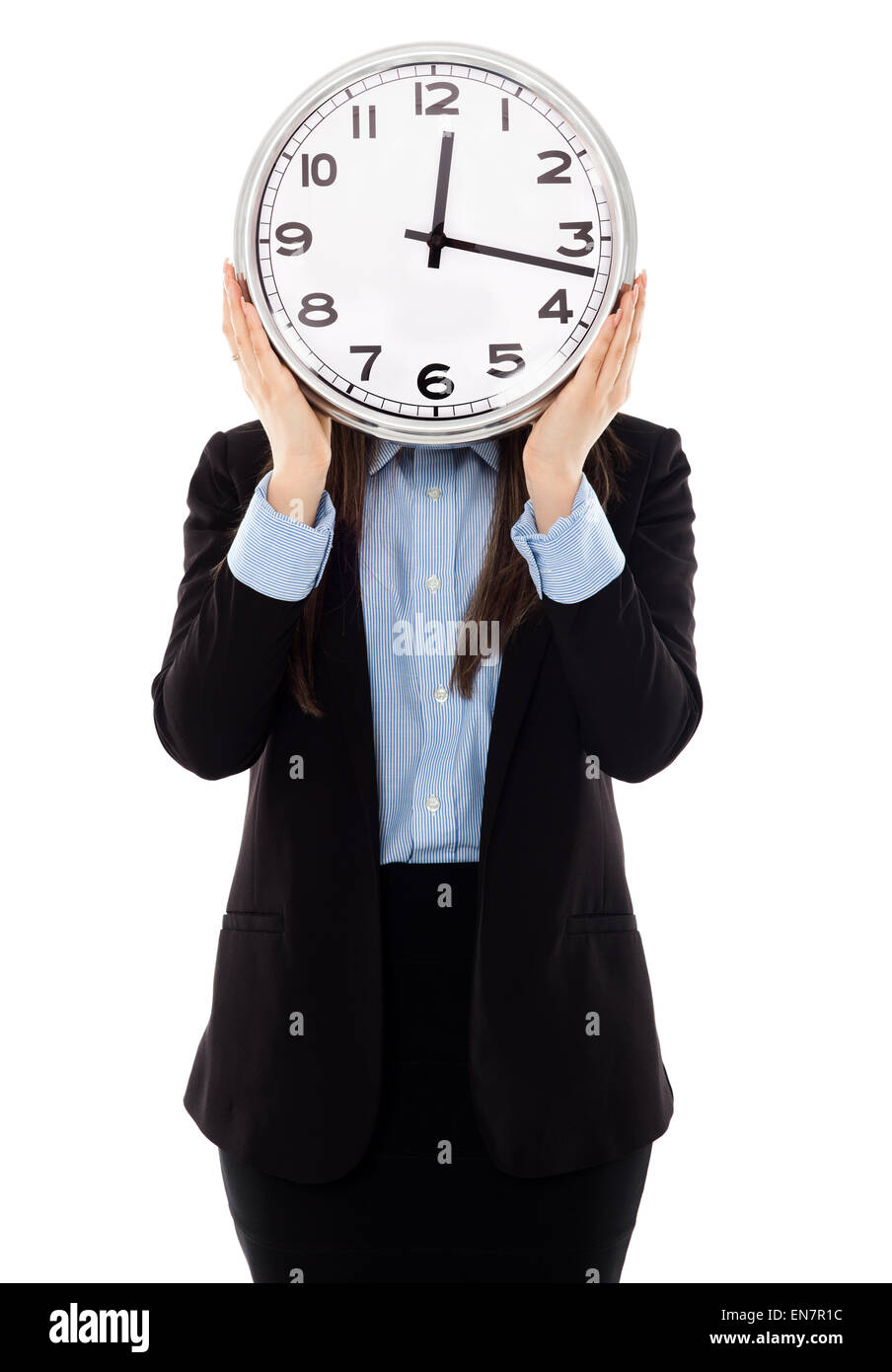 Closeup of young businesswoman covering her face with analog clock ...
