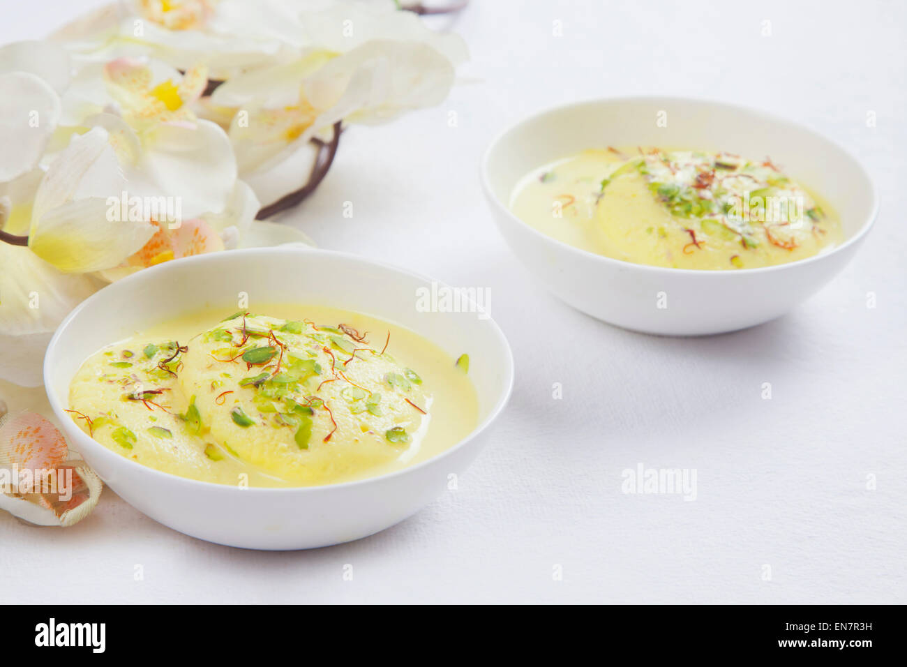 Ras malai in a bowl Stock Photo - Alamy