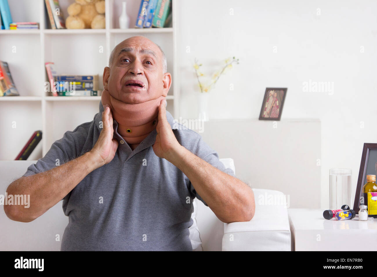 Old man with neck brace Stock Photo - Alamy