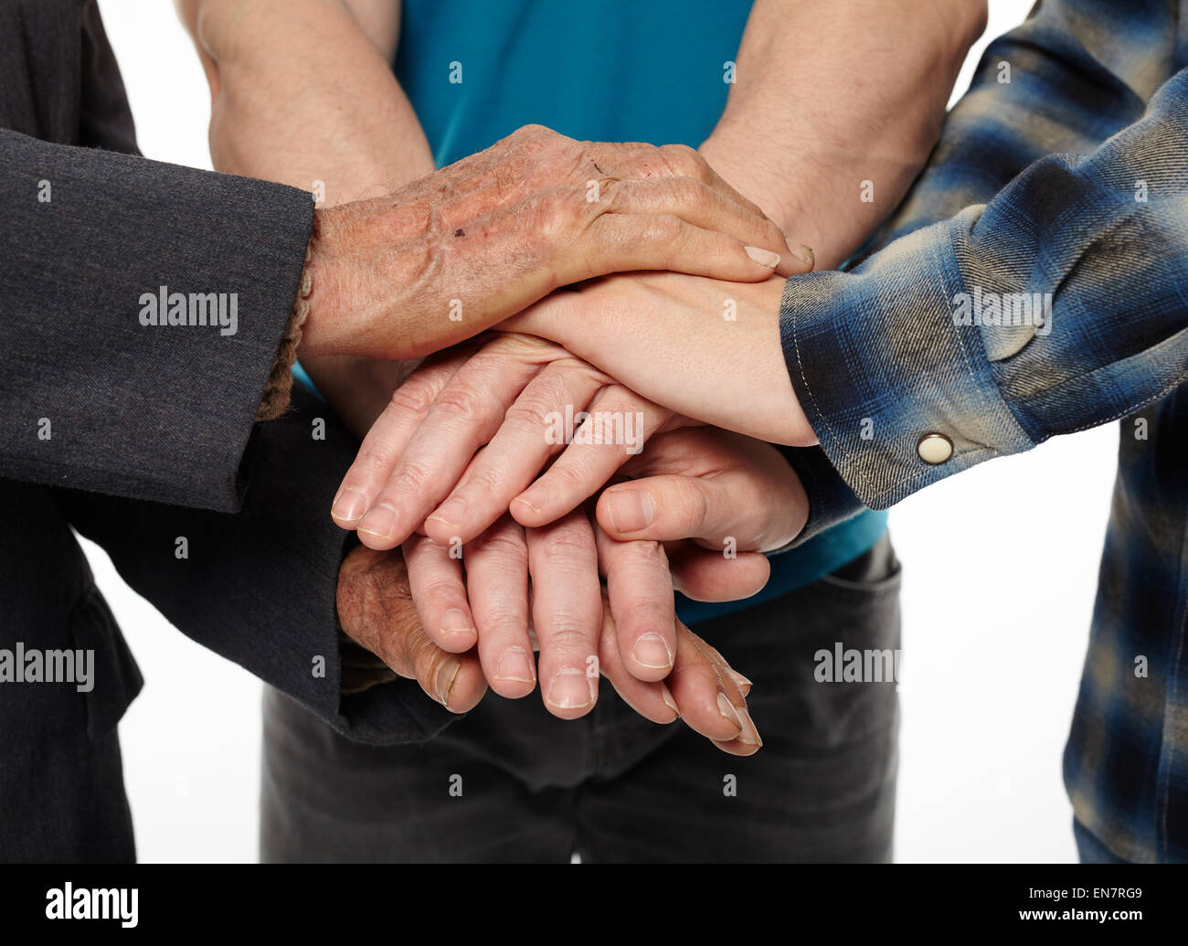 Three generations - grandfather, son and grandson holding hands, giving ...