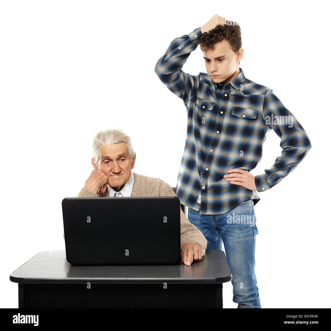 Teenage boy teaching his grandfather how to use a laptop Stock Photo ...