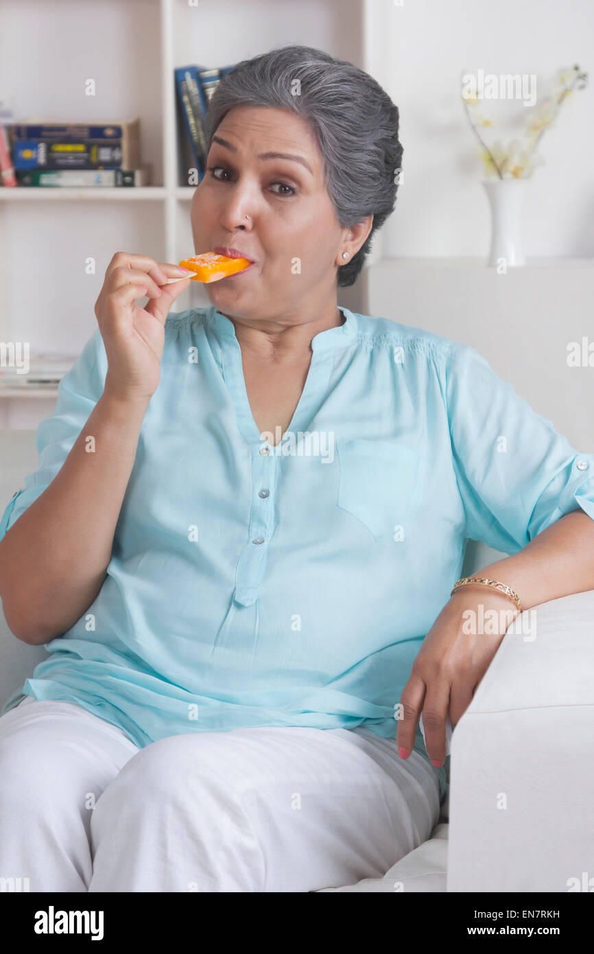 Old woman eating ice cream hi-res stock photography and images - Alamy