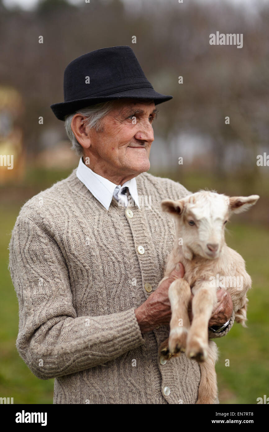 Man holding goat hi-res stock photography and images - Alamy