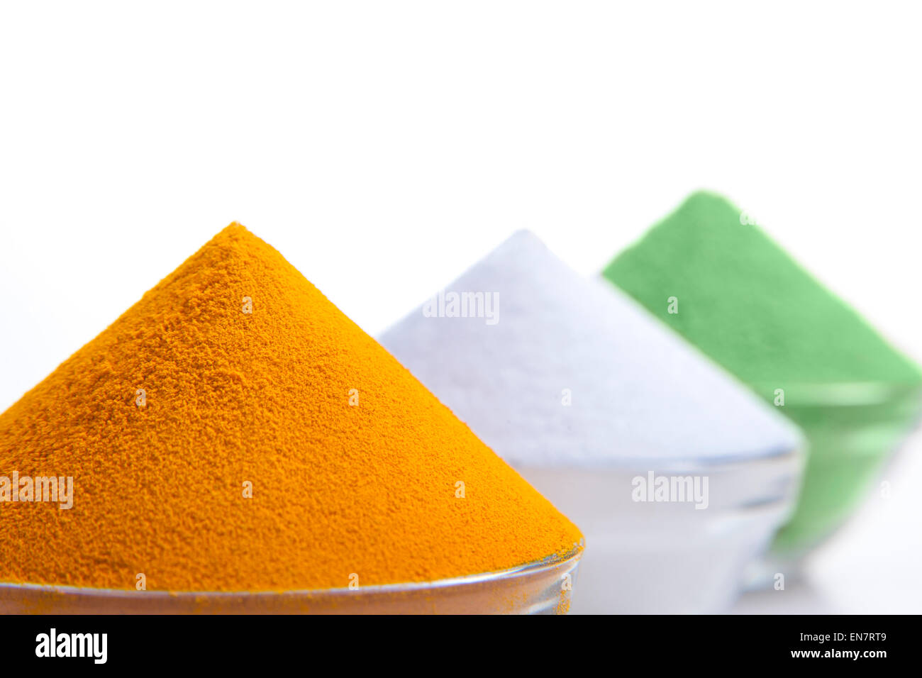Tri color spices arranged in bowls Stock Photo - Alamy