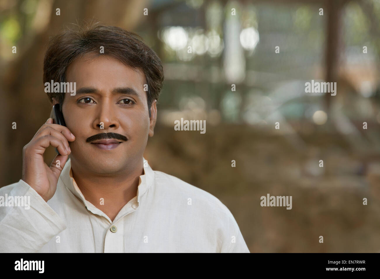 Man talking on cell phone Stock Photo - Alamy