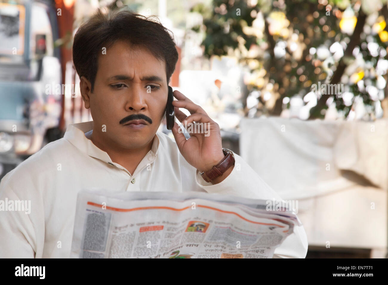 Using man newspaper hi-res stock photography and images - Alamy