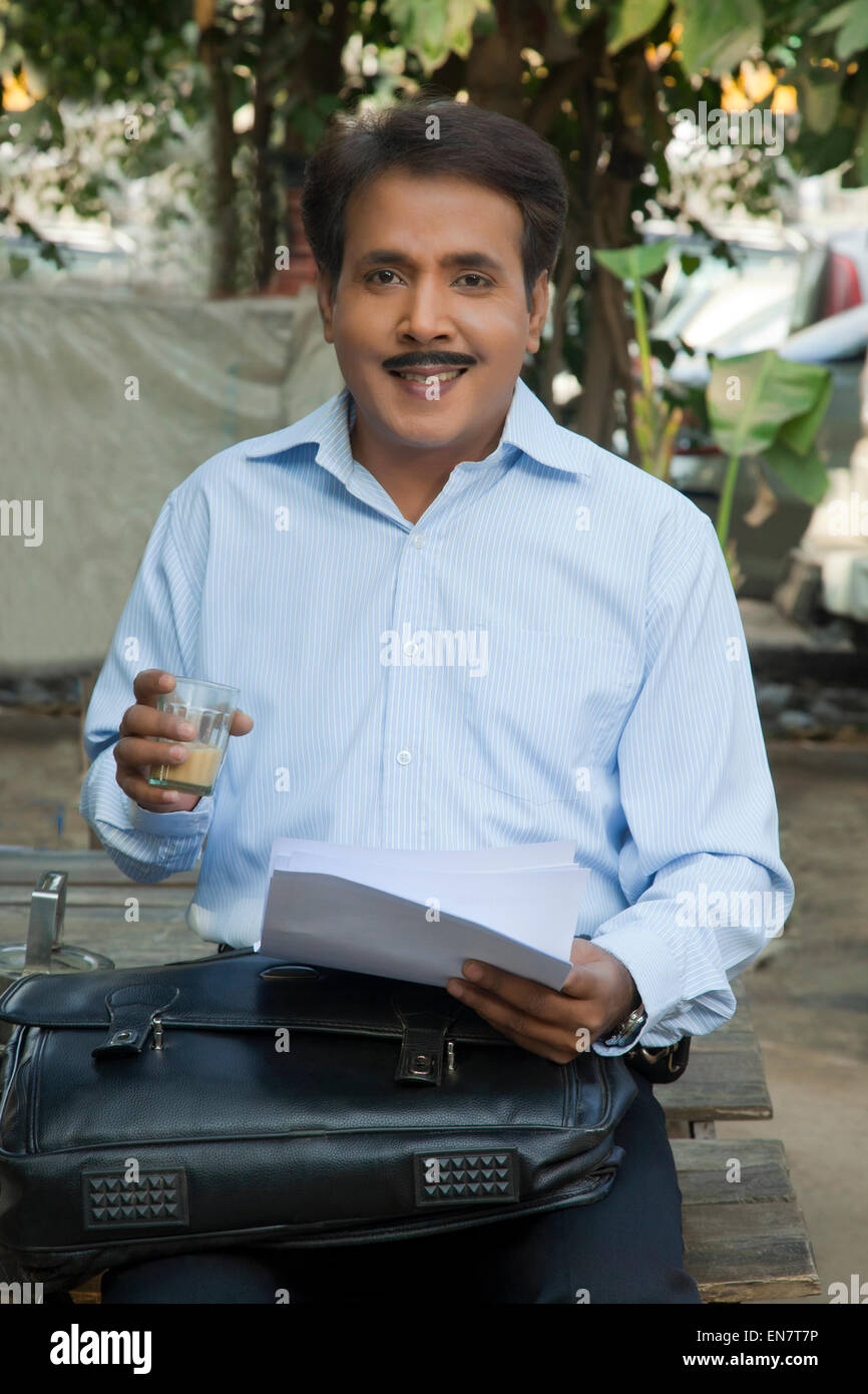 Salesman looking at camera and smiling Stock Photo - Alamy