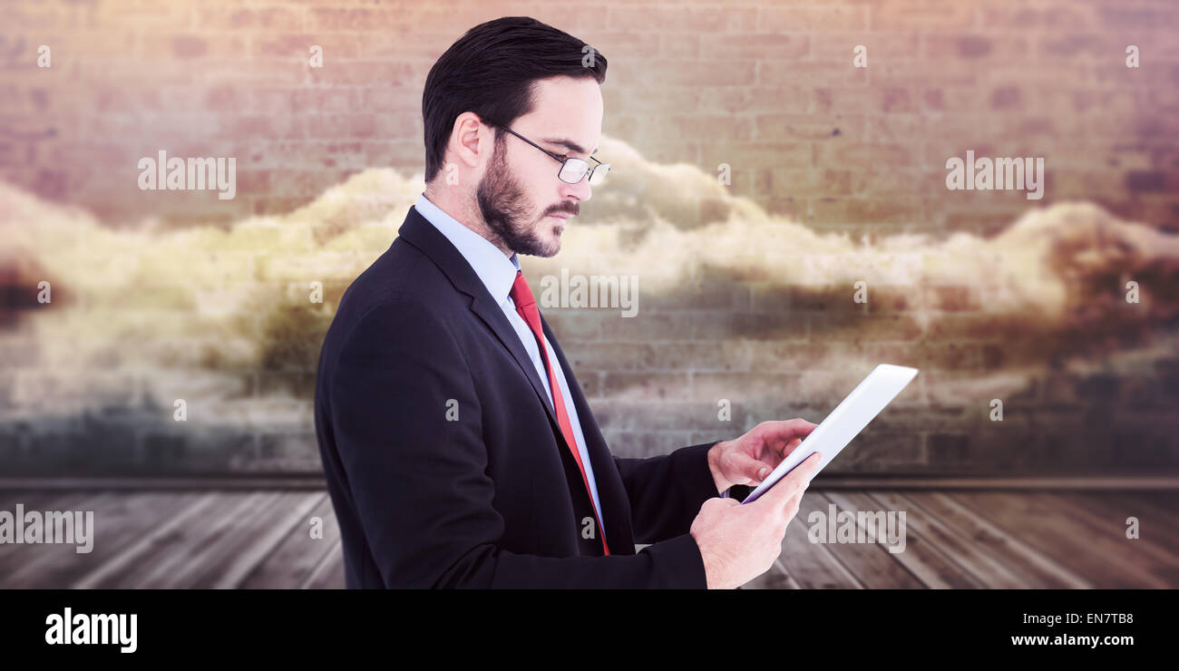 Composite image of businessman scrolling on his digital tablet Stock ...
