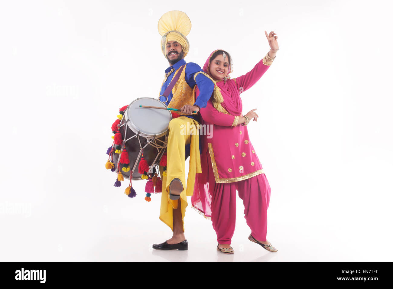 Portrait of Sikh couple doing bhangra dance Stock Photo - Alamy